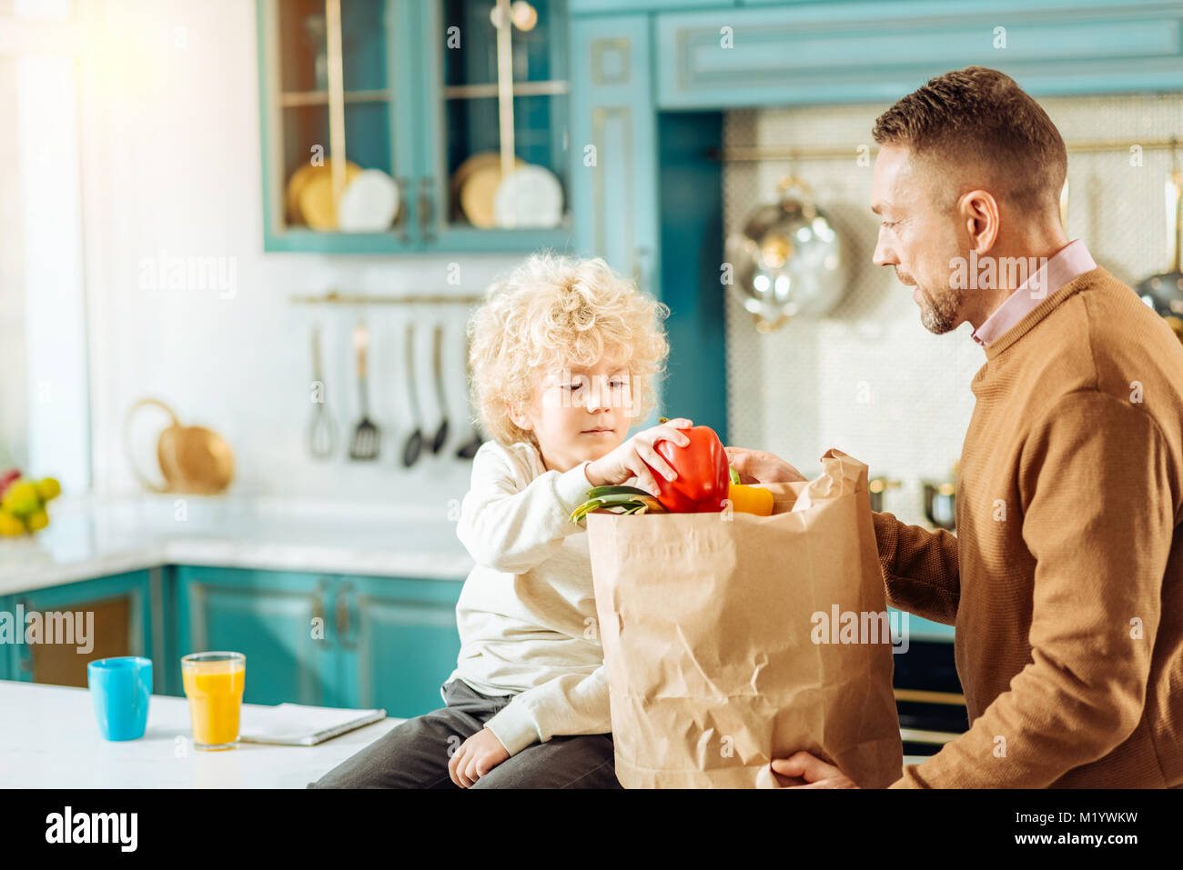 Boy helping his father hi-res stock photography and images - Alamy