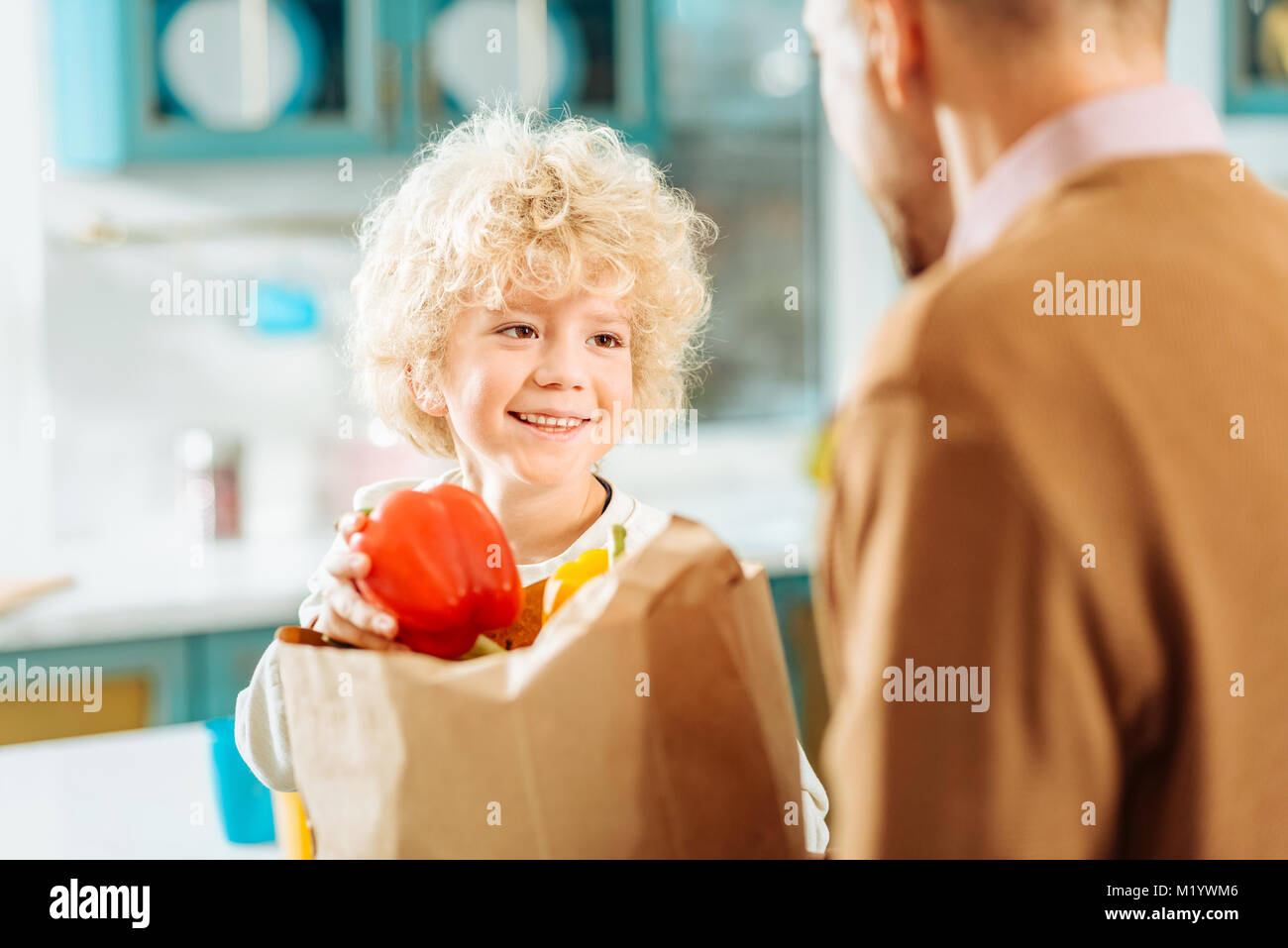 Cheerful delighted boy smiling Stock Photo - Alamy