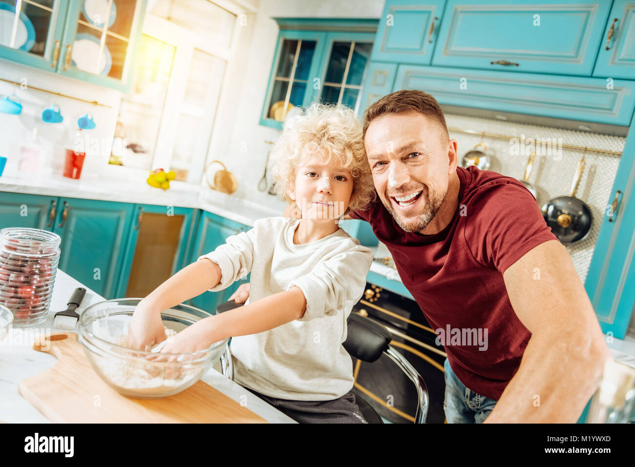 Happy positive father enjoying time with his son Stock Photo - Alamy