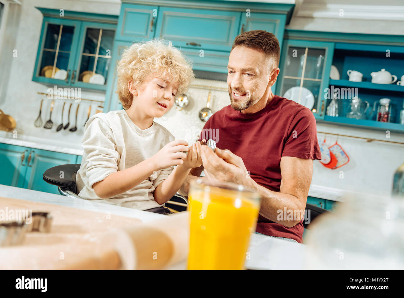 Pleasant cute child spending time with his father Stock Photo - Alamy