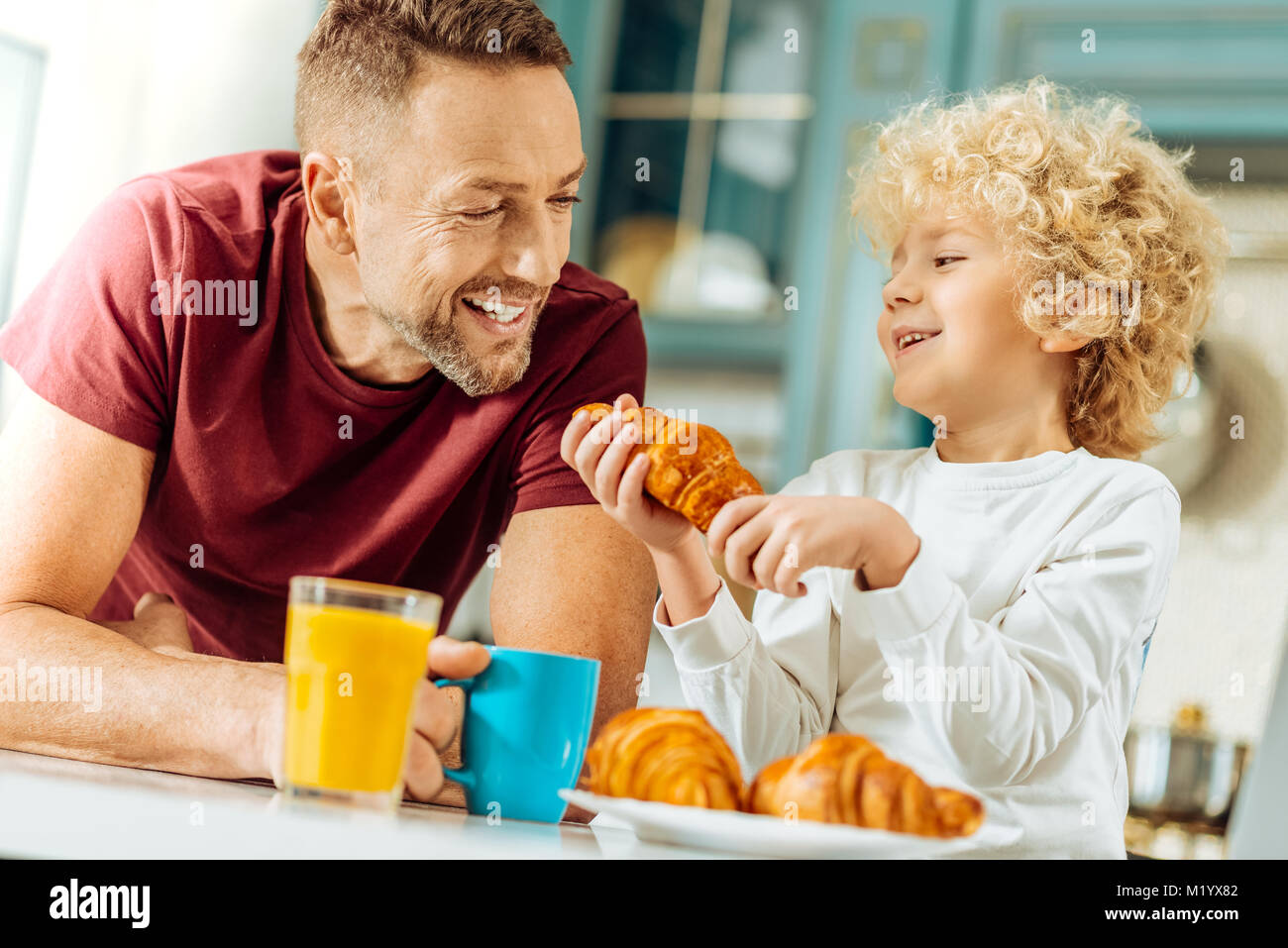 Happy delighted boy laughing Stock Photo - Alamy