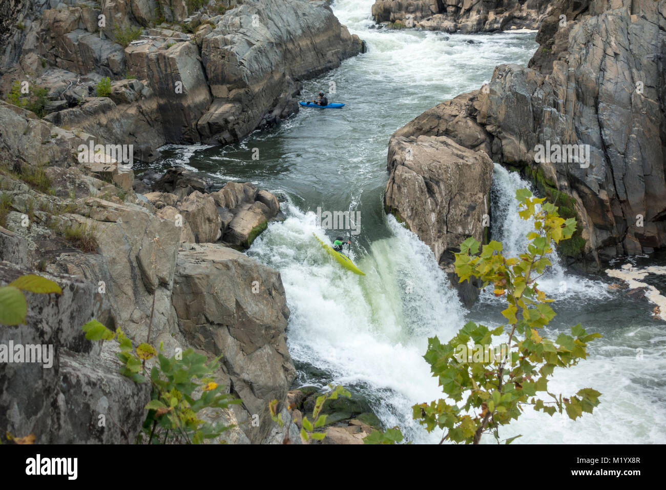 A kayaker going over a waterfall rapid on the Great Falls, Virginia ...