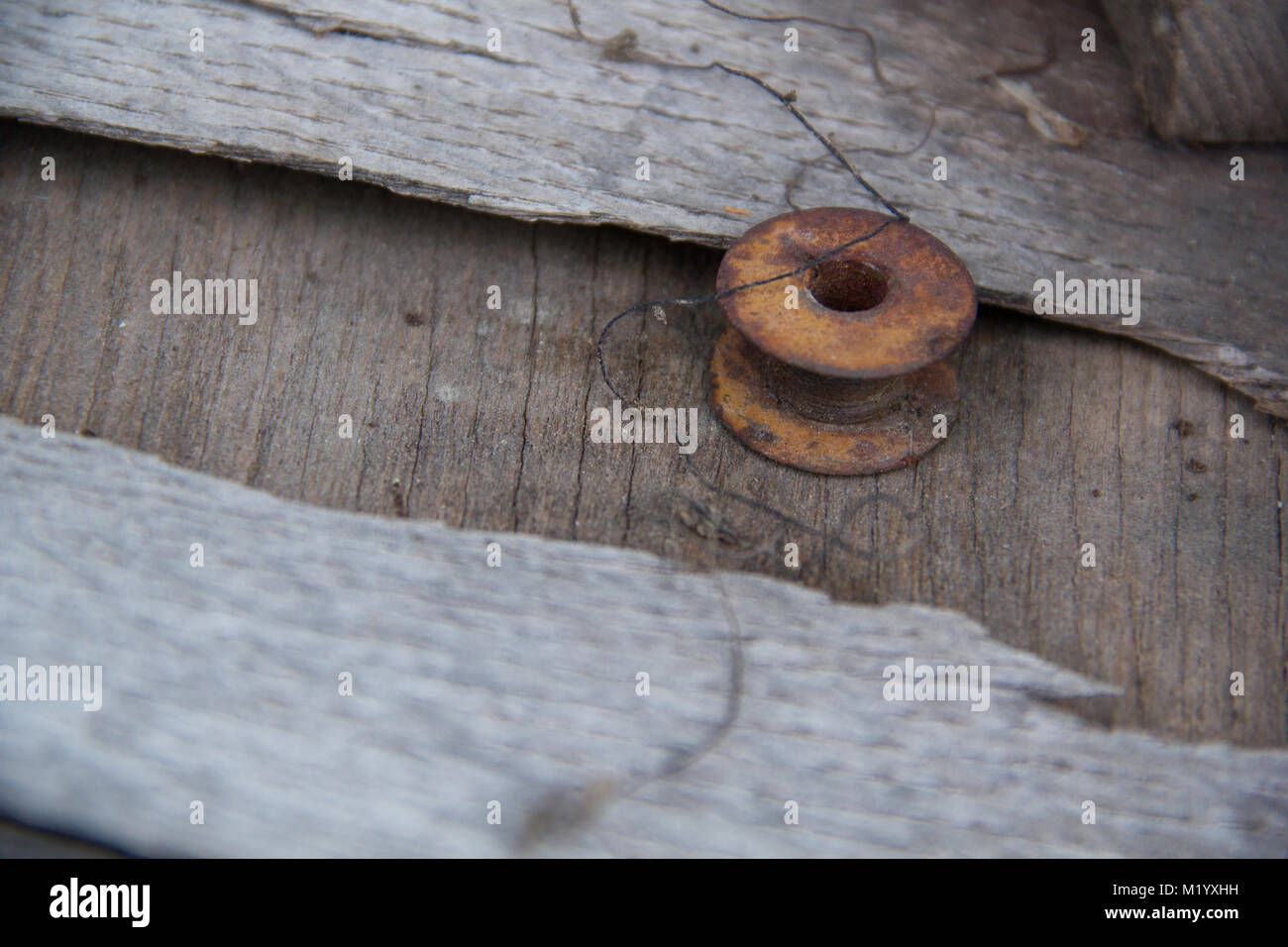 Old Singer sewing machine spindle rusted with thread Stock Photo - Alamy
