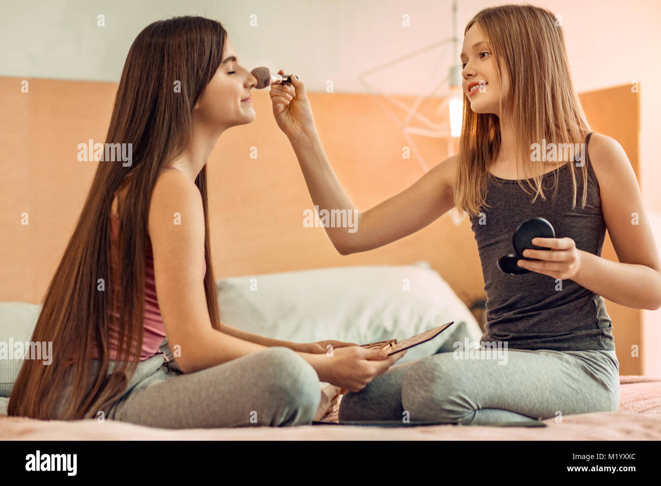 Applying powder to nose hi-res stock photography and images - Alamy