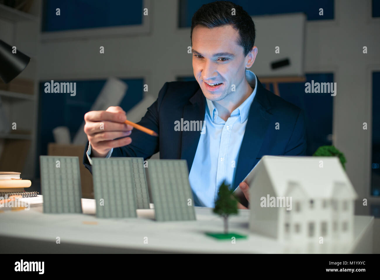 Inspired male engineer creating model Stock Photo - Alamy