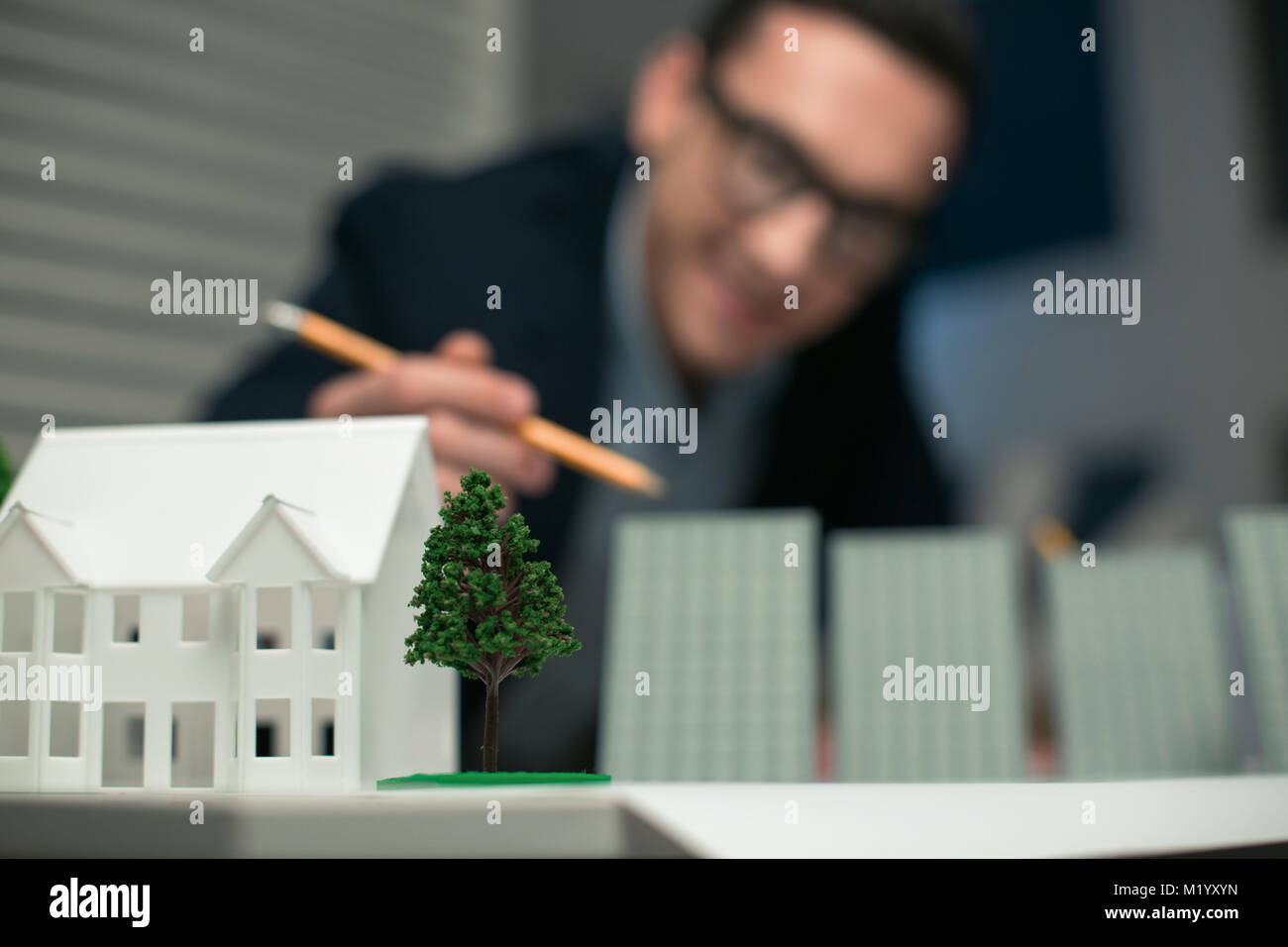 Professional male engineer constructing model Stock Photo - Alamy