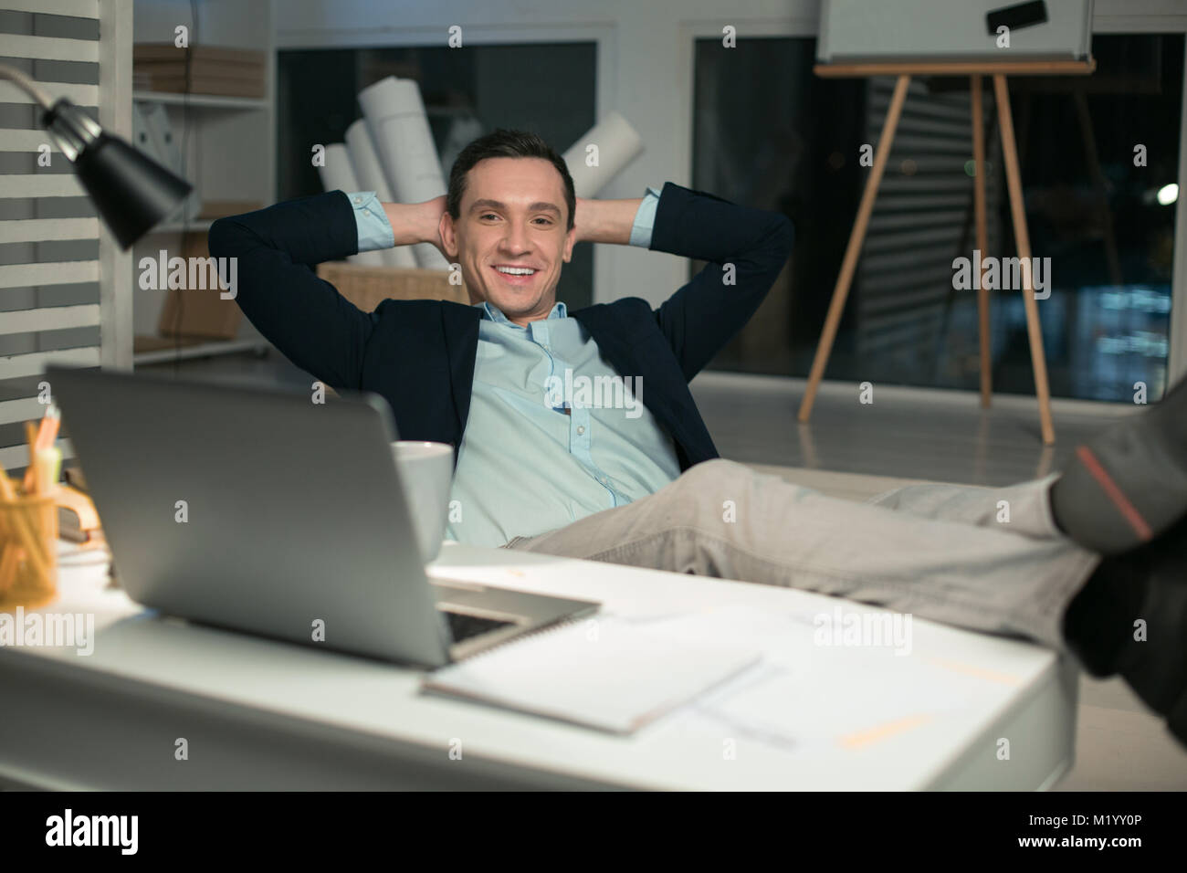 Cheerful male real estate agent receiving order Stock Photo - Alamy