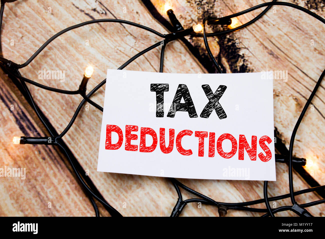 Handwritten text caption showing Tax Deductions. Business concept ...
