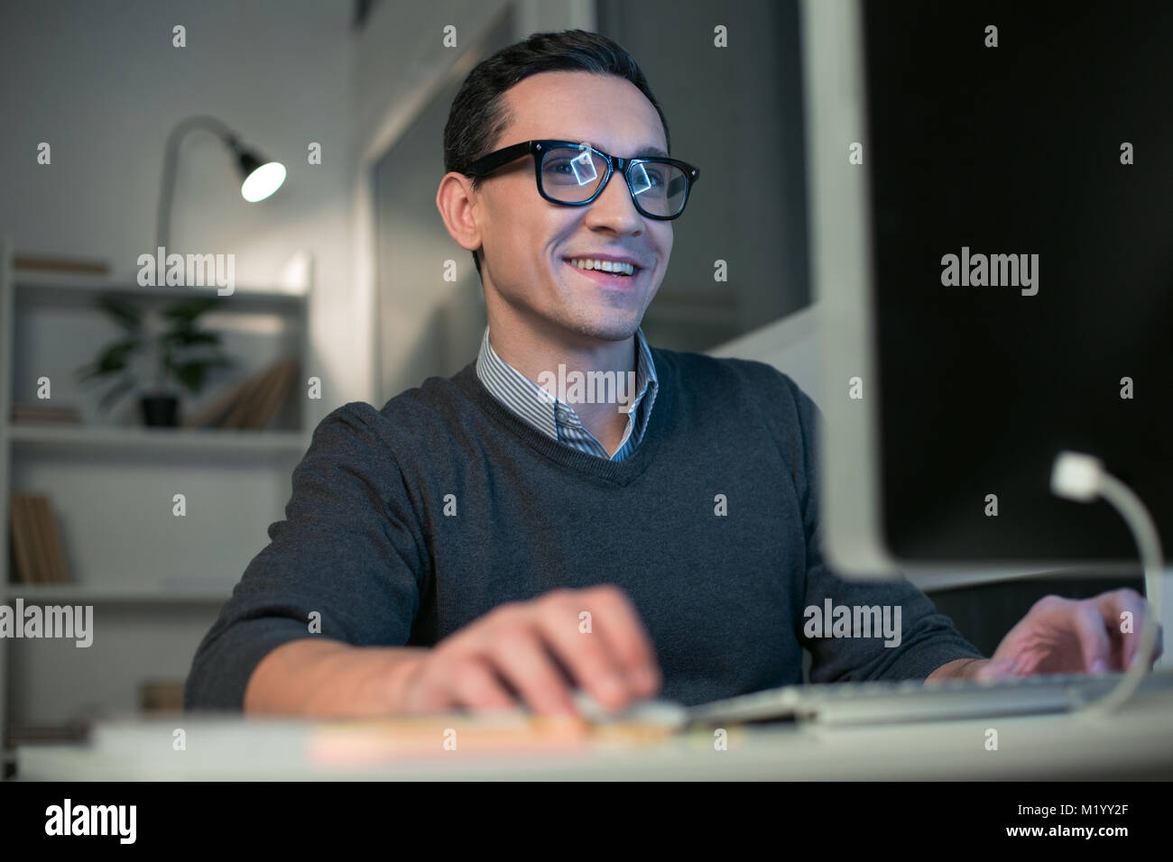 Attractive male programmer creating software Stock Photo - Alamy