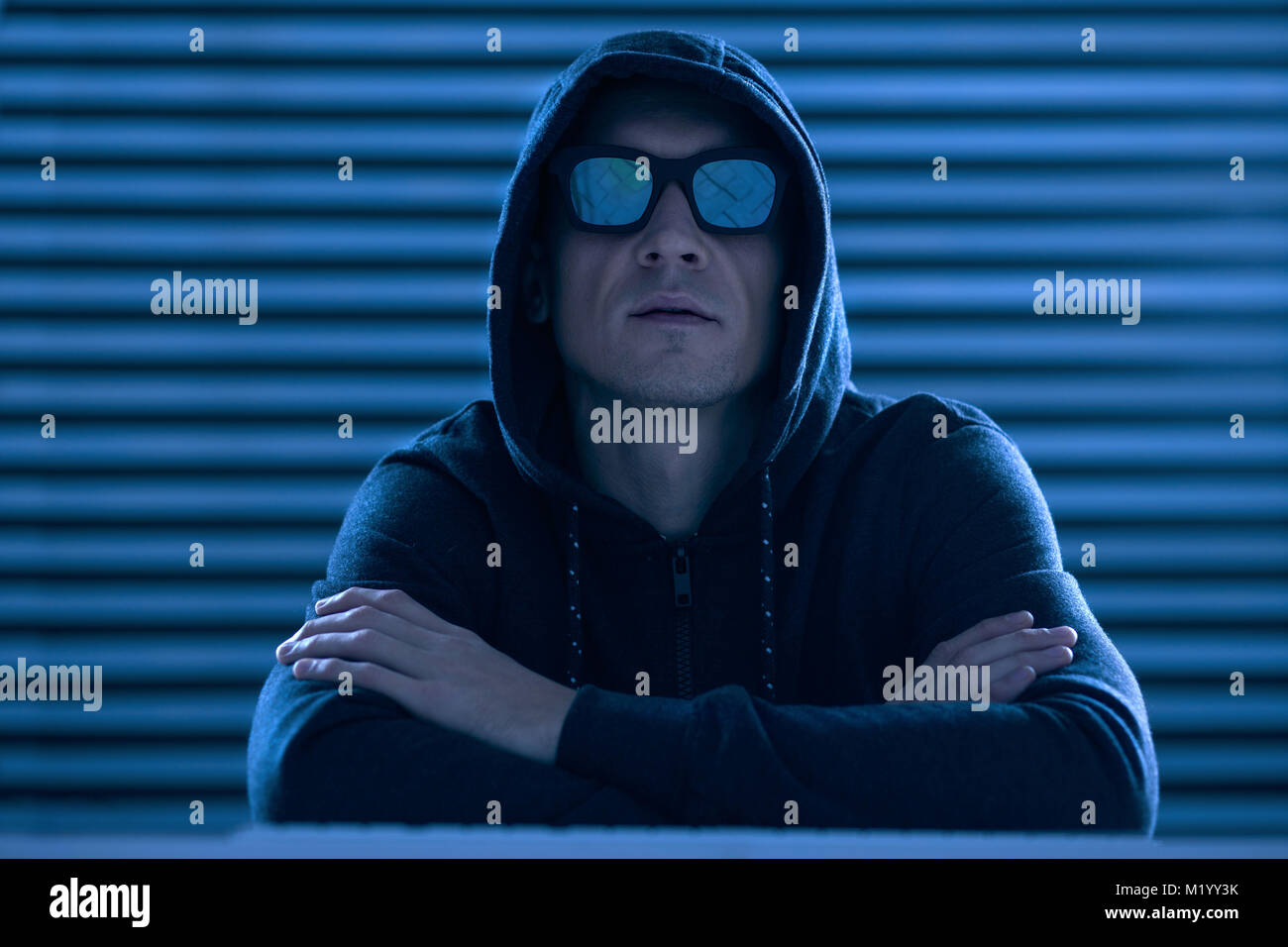 Cool male hacker stealing data Stock Photo - Alamy