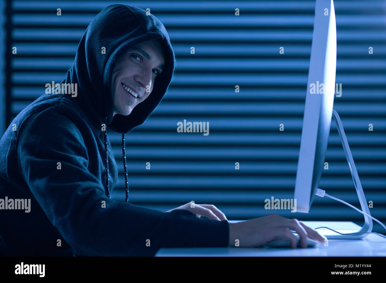 Happy male gamer finishing game Stock Photo - Alamy