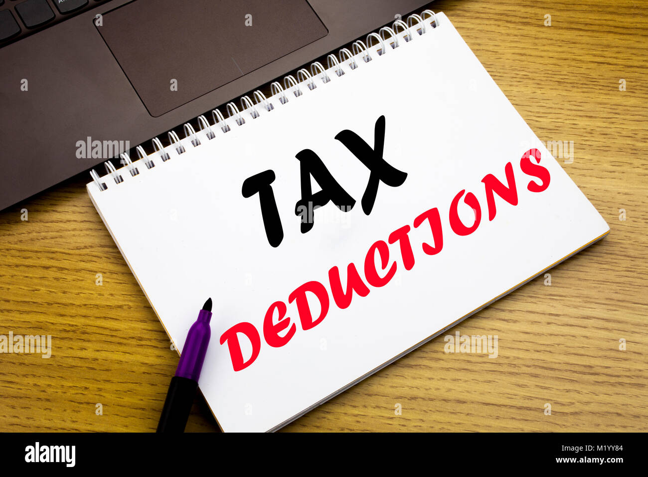 Hand writing text caption inspiration showing Tax Deductions. Business ...