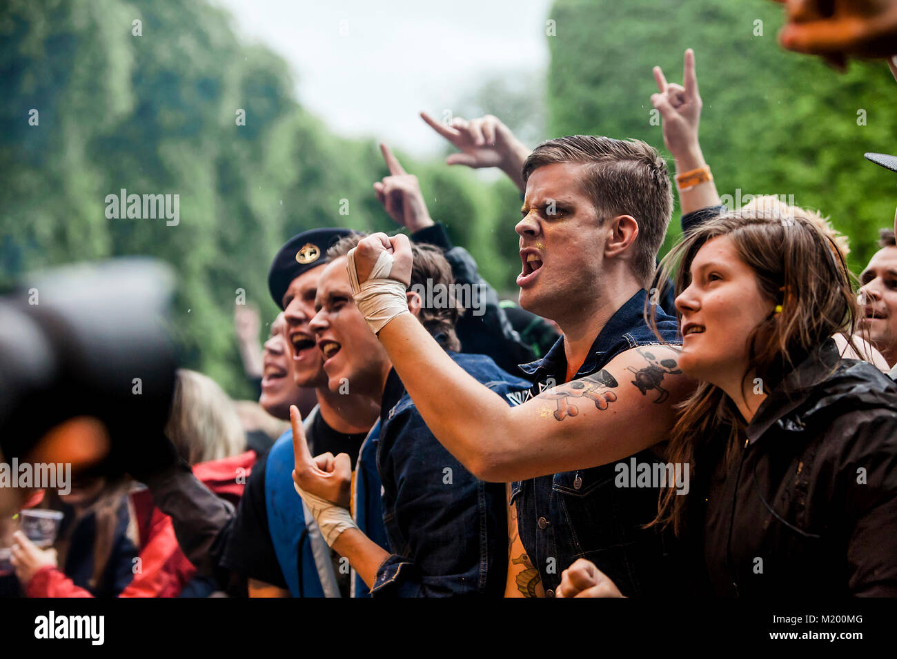 Enthusiastic and energetic music fans attend a live concert with the ...