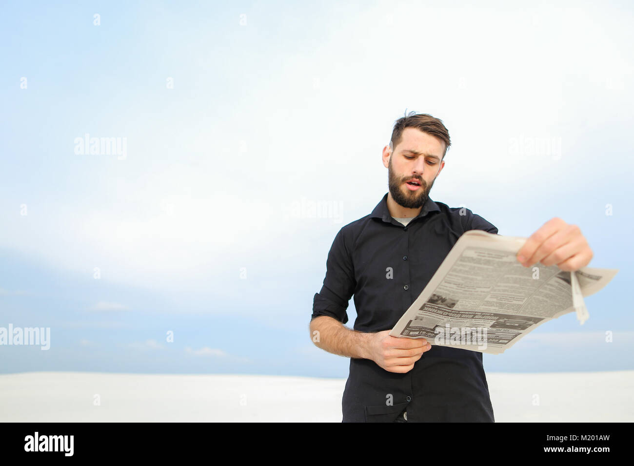 doctor reading newspaper in countryside Stock Photo - Alamy