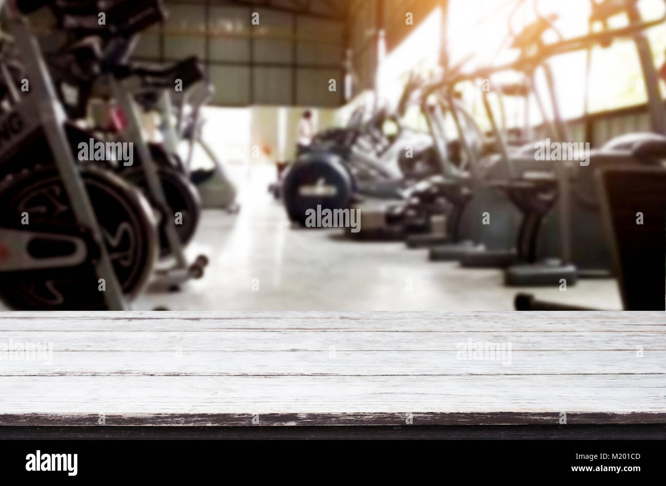 Wooden table on blurred background of fitness gym interior of modern ...