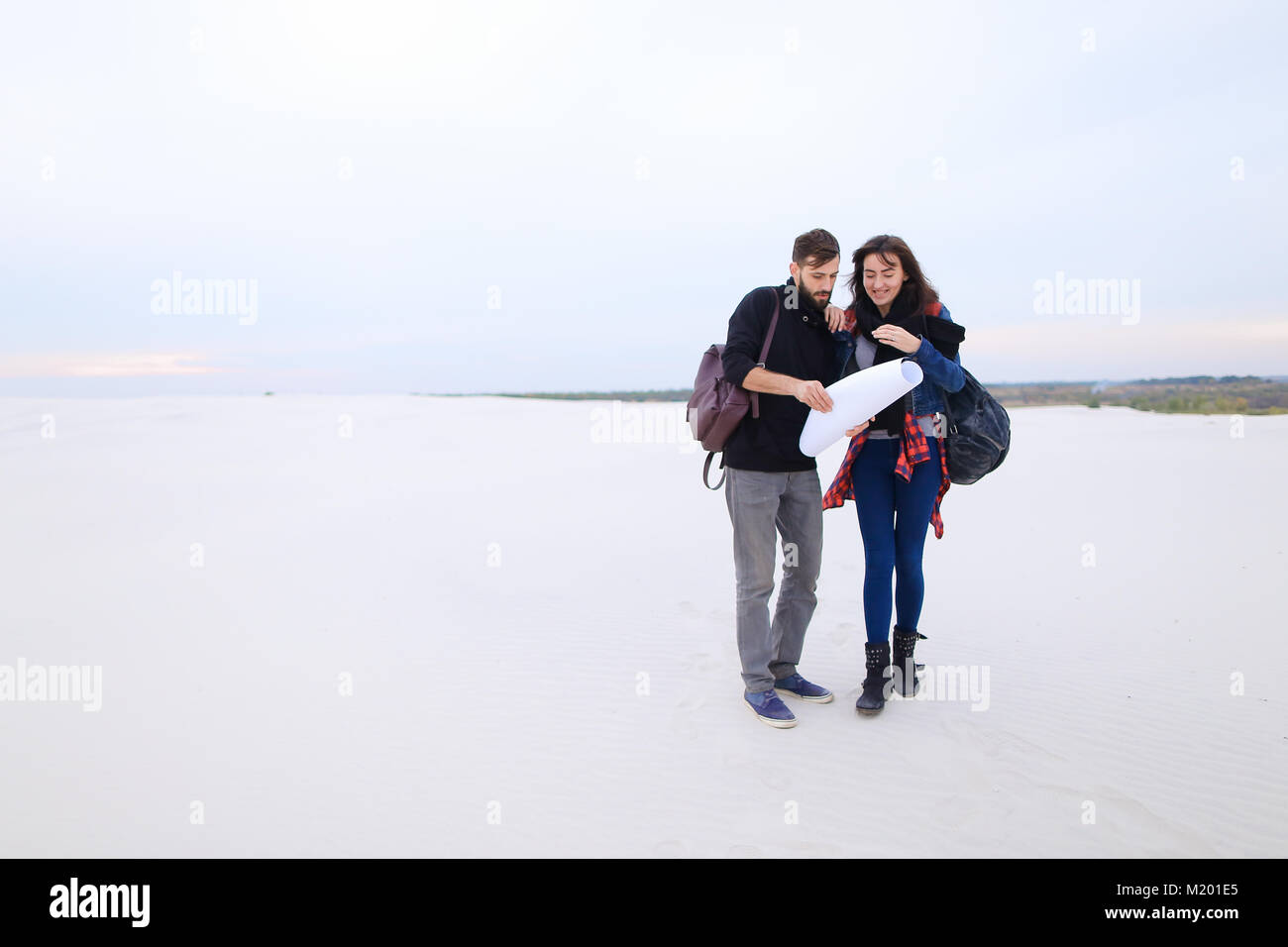 Presenters of travel program married couple viewing map Stock Photo - Alamy