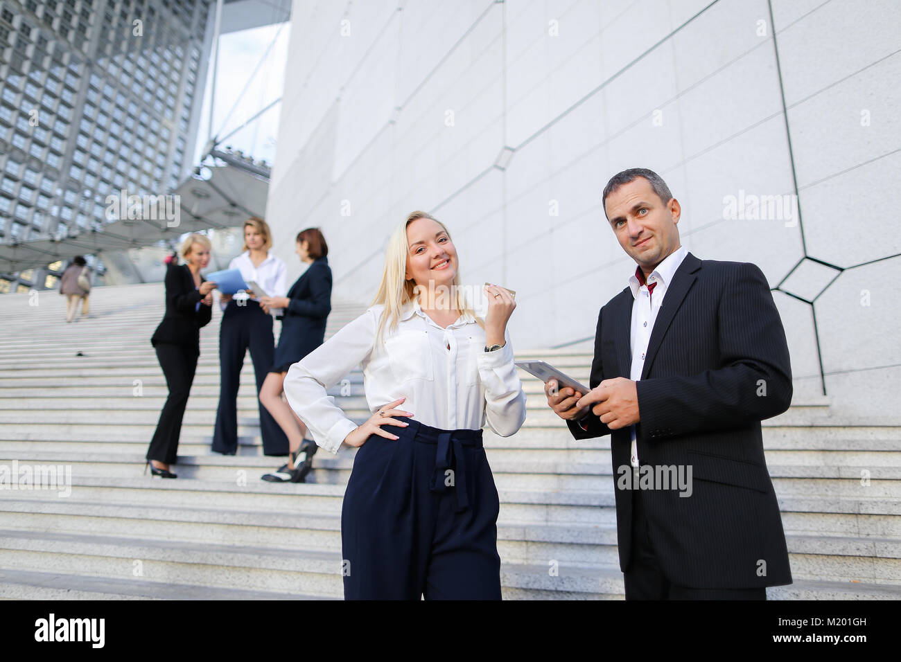 Successful business team walking on stairs in Stock Photo - Alamy