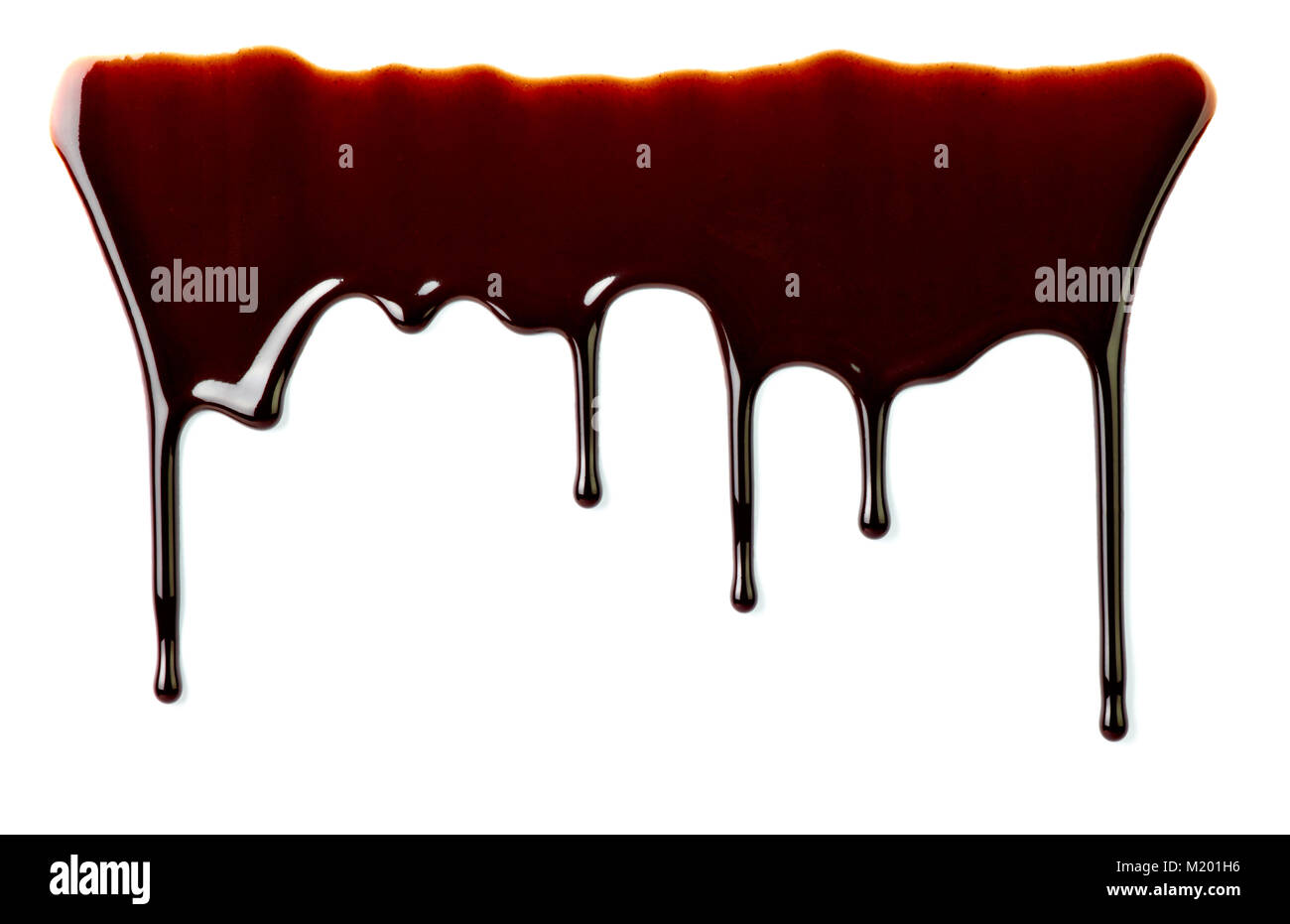 close up of chocolate syrup leaking on white background Stock Photo - Alamy