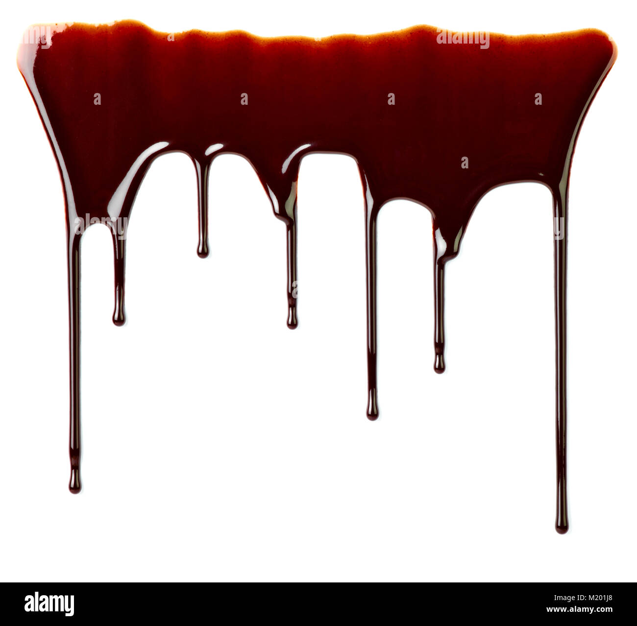 close up of chocolate syrup leaking on white background Stock Photo - Alamy