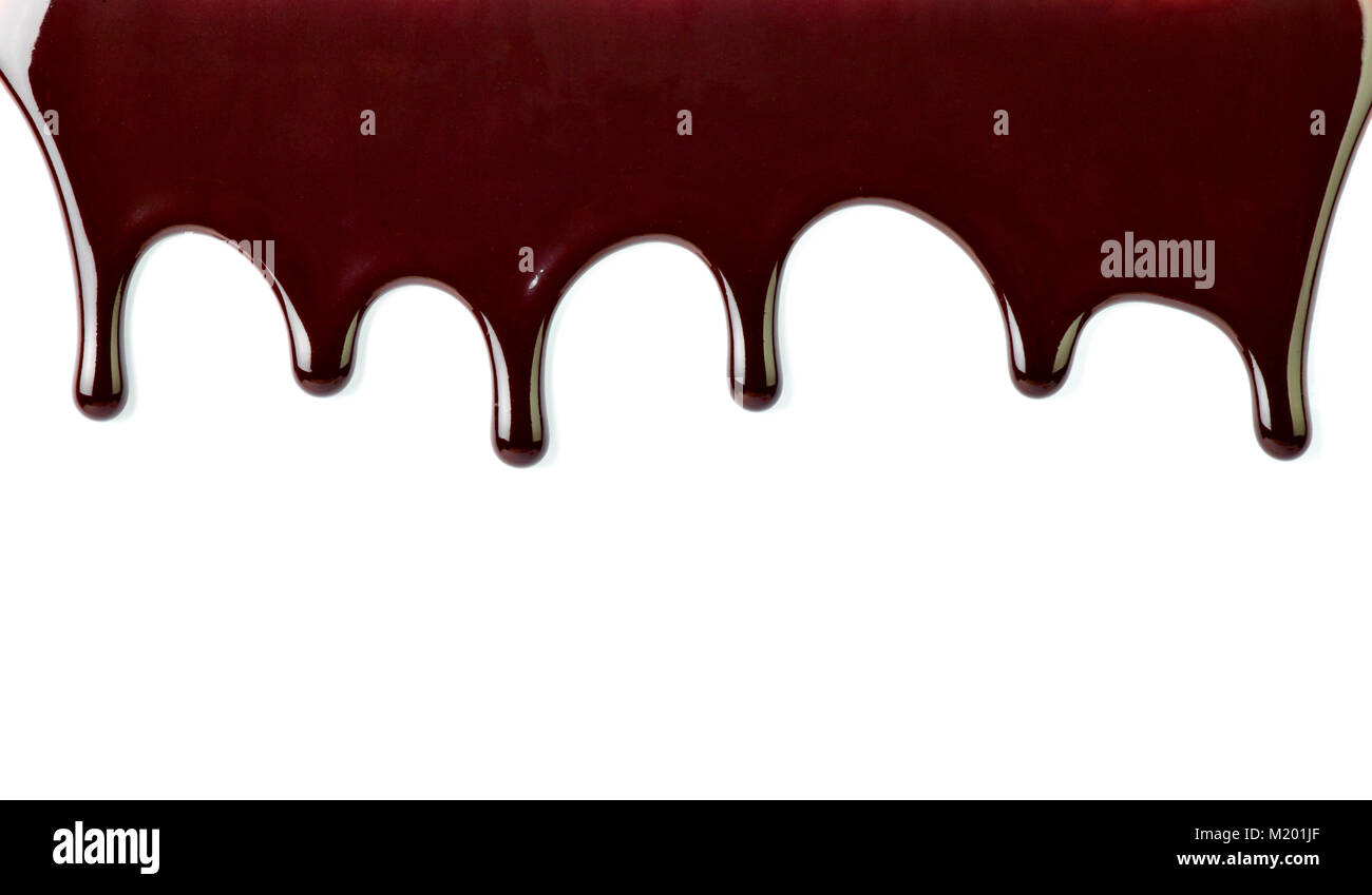 close up of chocolate syrup leaking on white background Stock Photo - Alamy