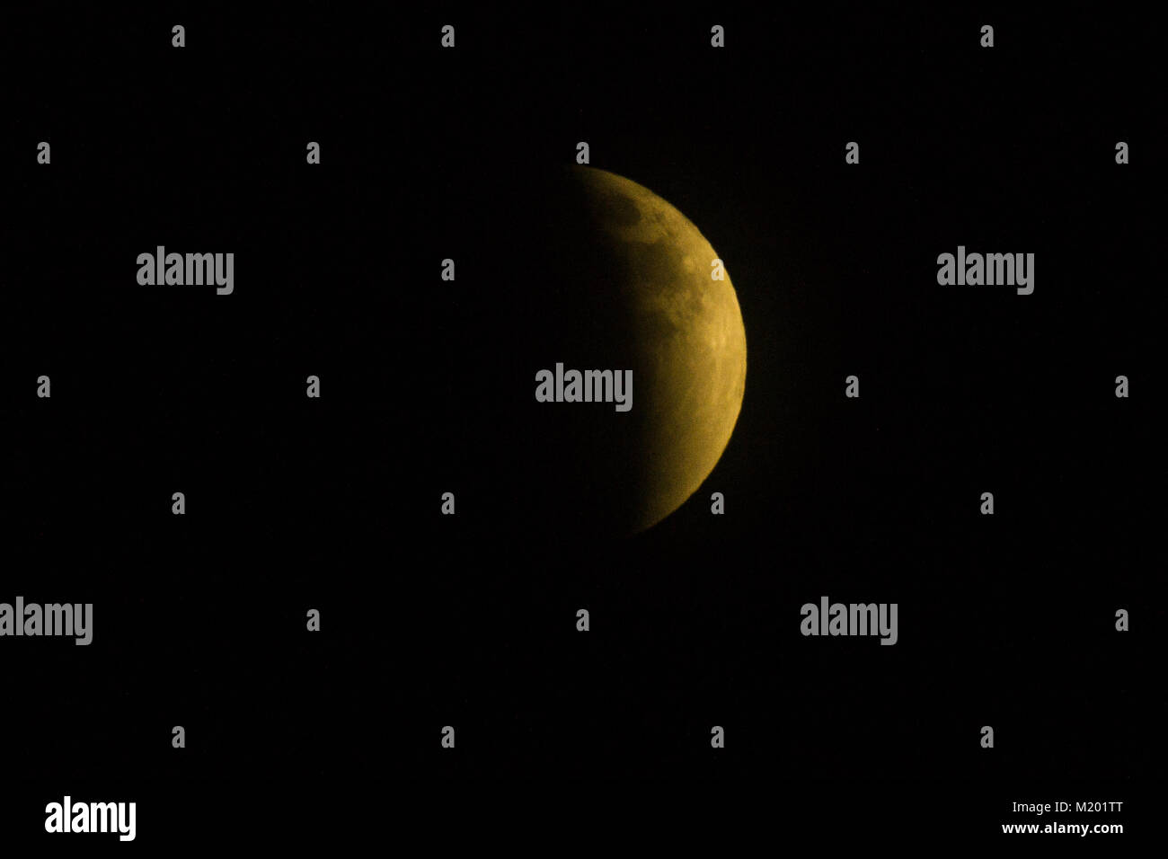 half yellow moon black sky night photography Stock Photo - Alamy