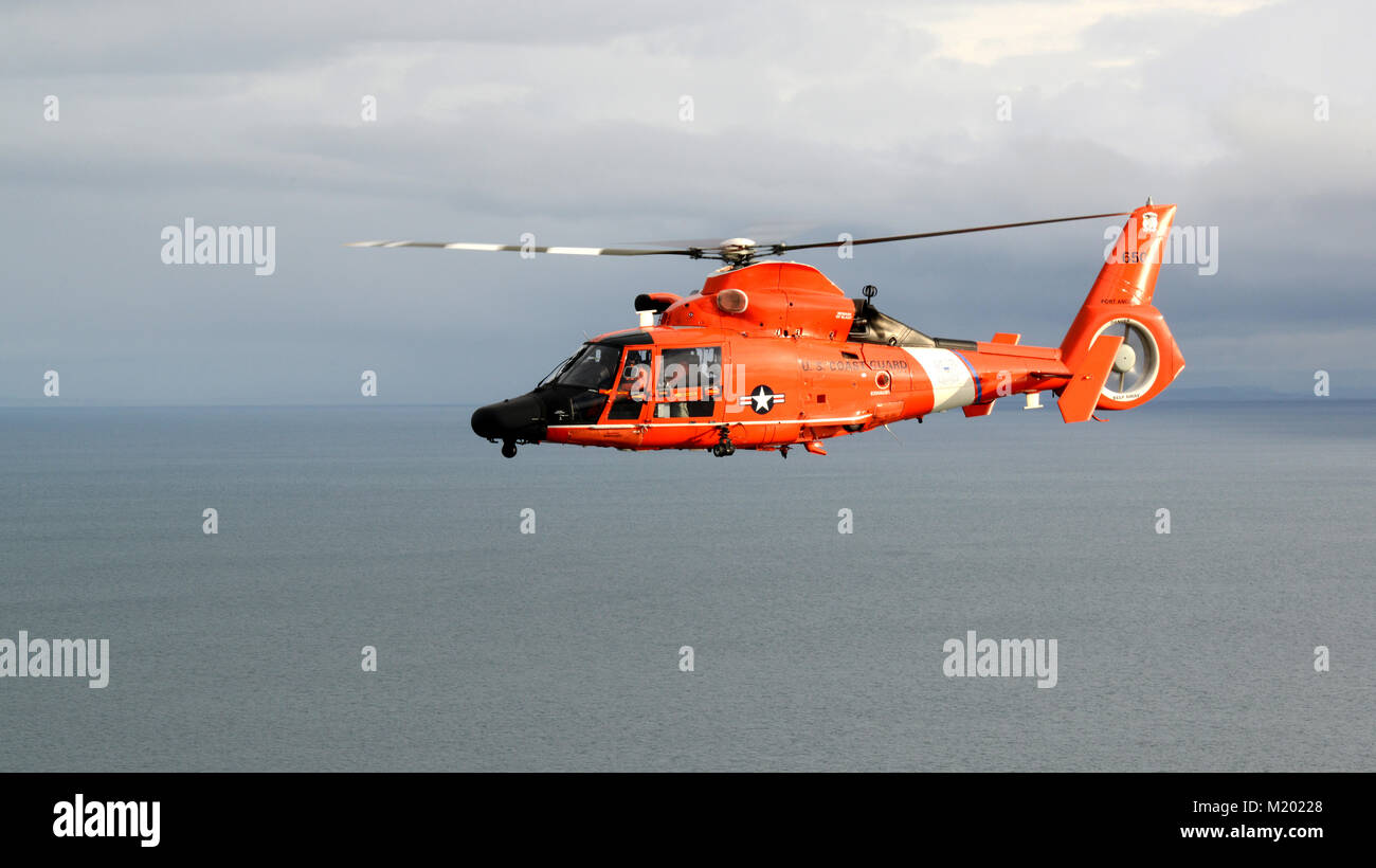 A Coast Guard MH-65 Dolphin helicopter crew from Air Station Port ...