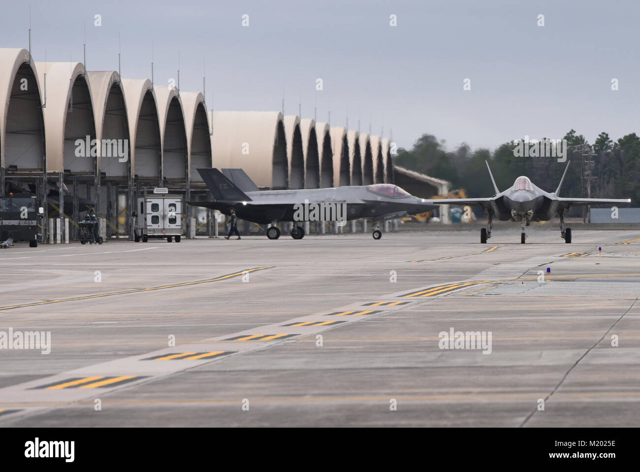 Two F-35As Lightning II taxi prior to taking off for an expanded ...
