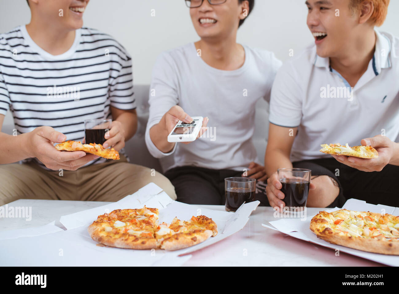People eat fast food. Friends hands taking slices of pizza Stock Photo ...