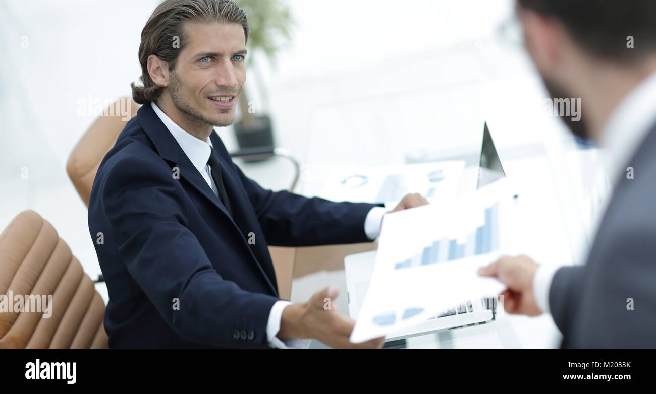 employee gives the Manager the financial report Stock Photo - Alamy