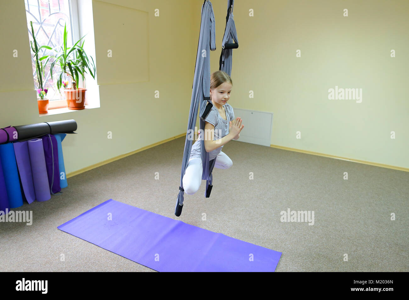 Little girl performs in air acrobatic elements Stock Photo - Alamy