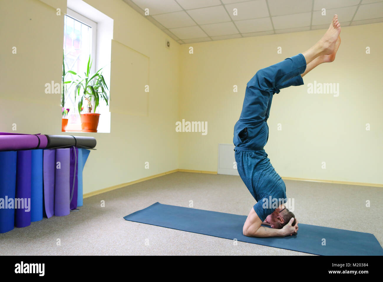 Beautiful young American performs asanas from yoga Stock Photo - Alamy