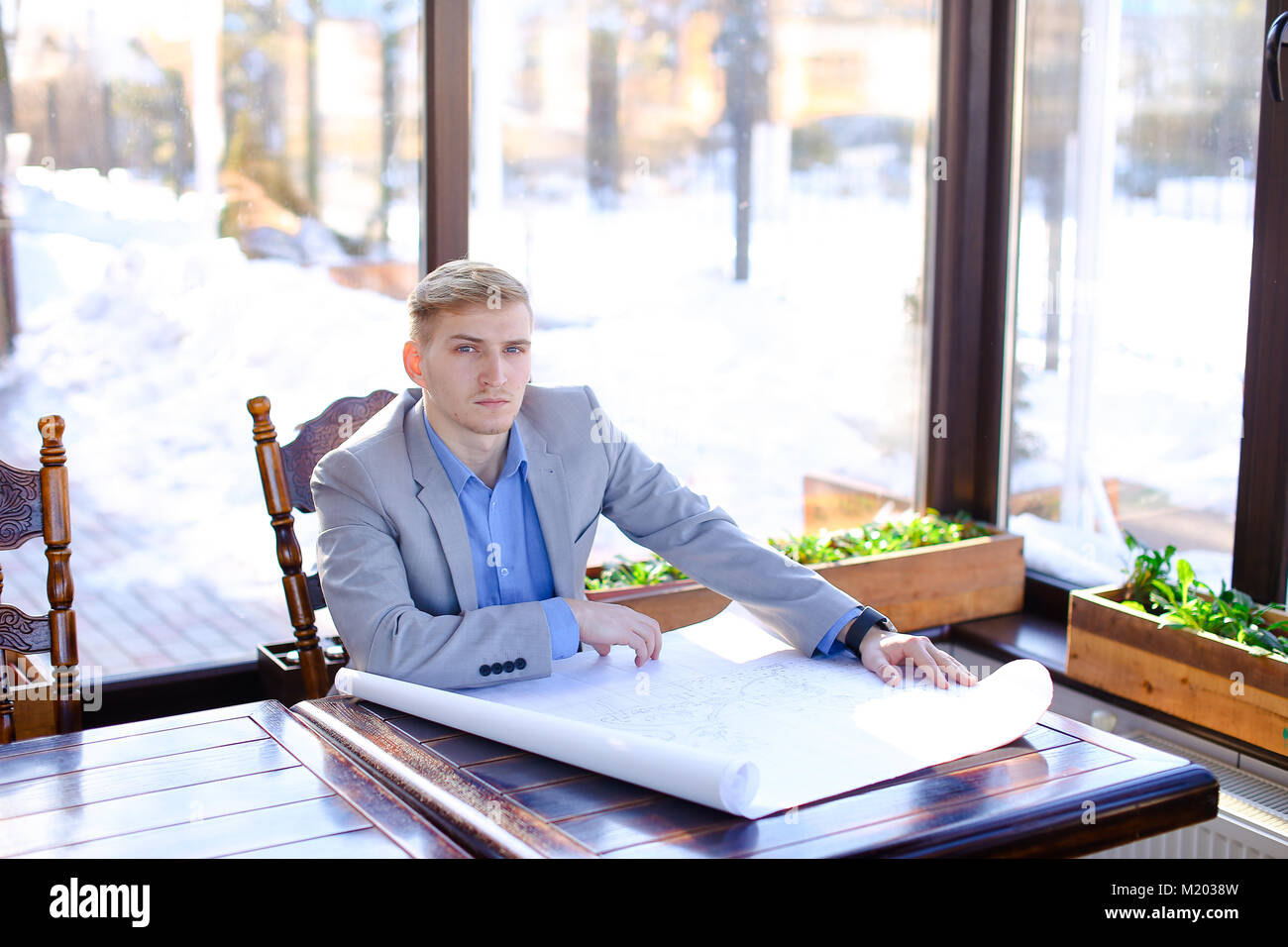 Student of architecture faculty looking at drafting work at cafe Stock ...