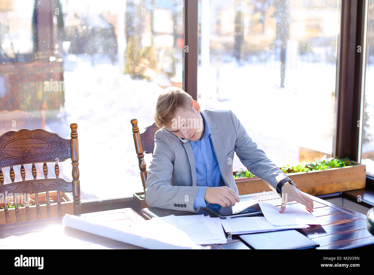 Young student preparing before exam in fast motion at cafe with Stock ...