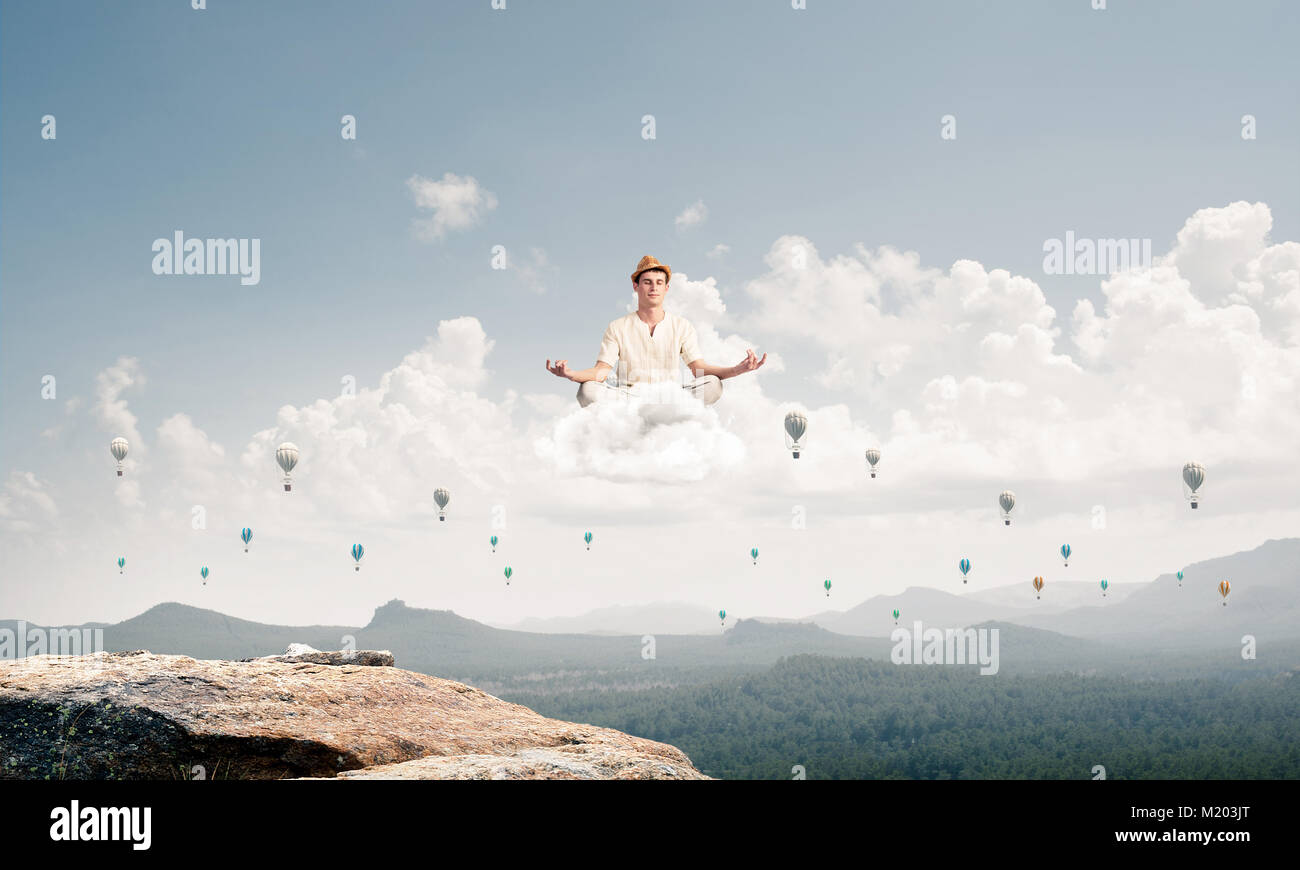 Young man keeping mind conscious Stock Photo - Alamy
