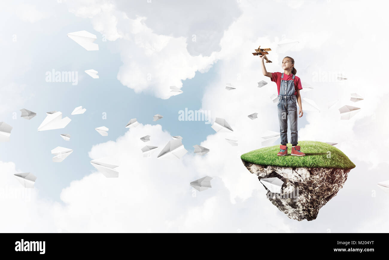 Concept of careless happy childhood with girl playing with airpl Stock ...