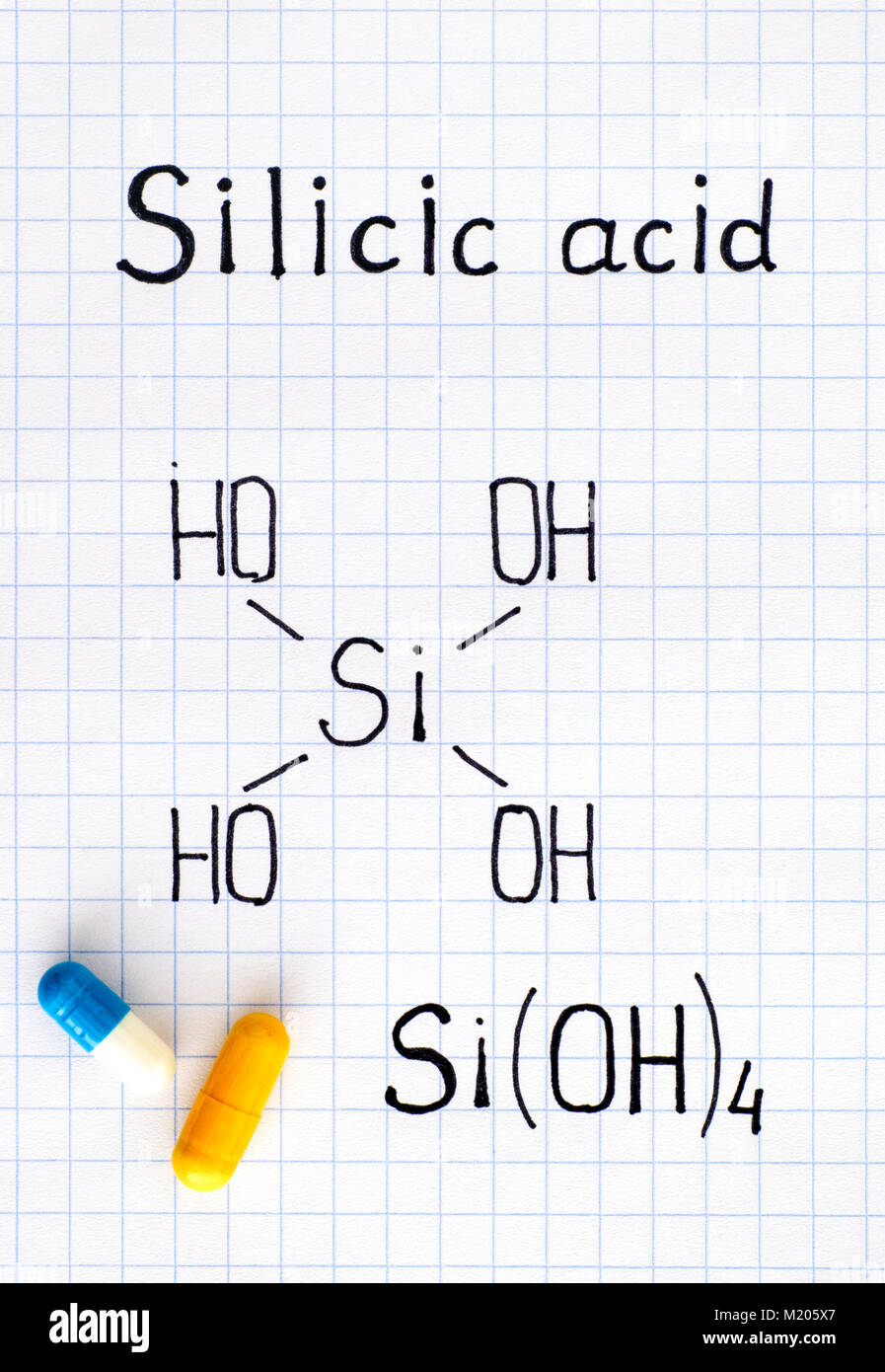 Chemical formula of Silicic acid with two pills. Close-up Stock Photo ...