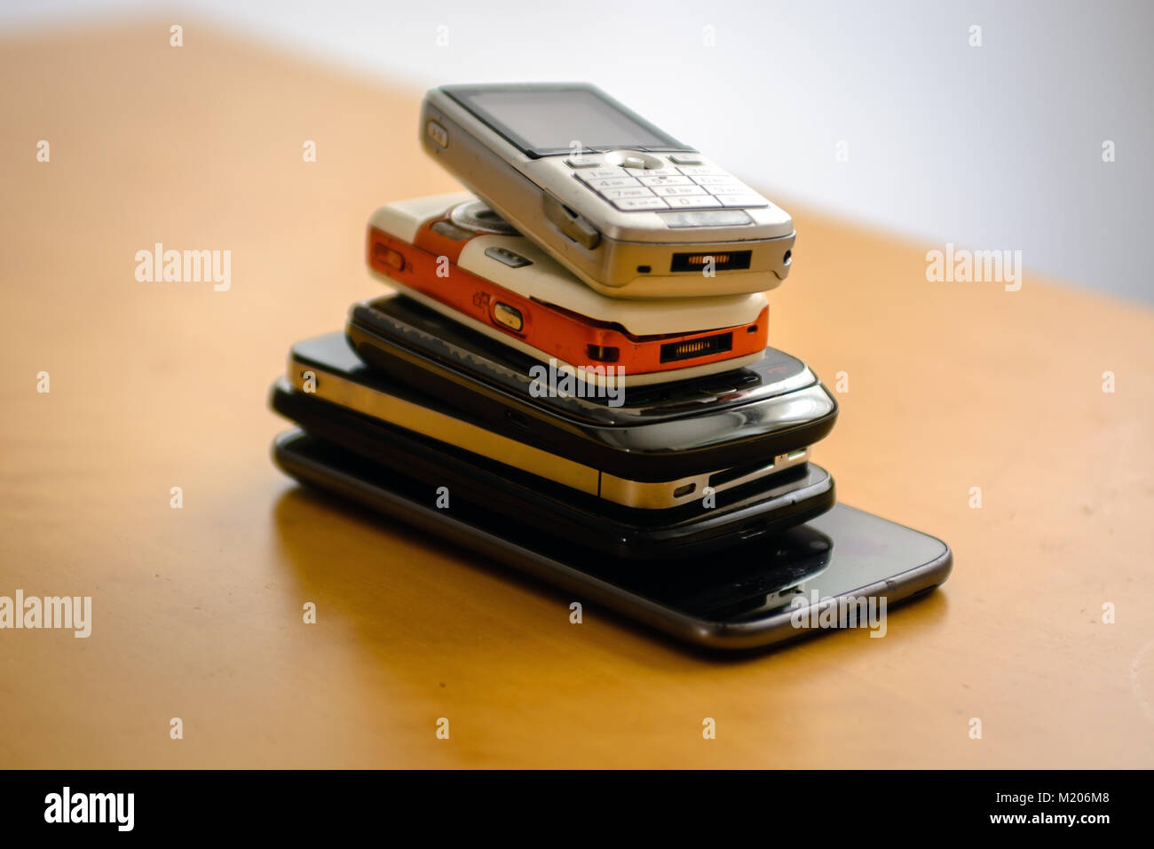 Pile of outdated Phones and Smartphones on a Table Stock Photo - Alamy