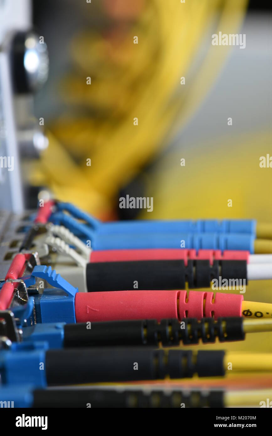 Fiber optical patch cord cable connected to switch in data center Stock ...