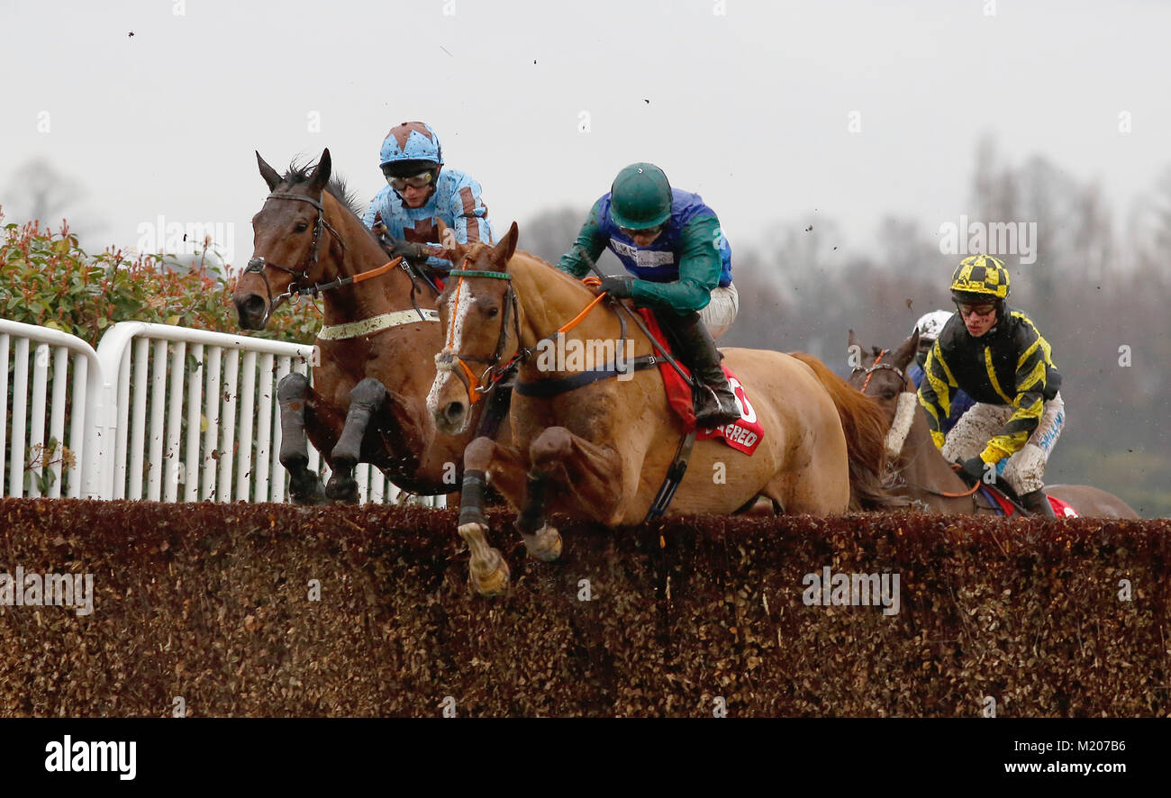 Ballydine and Sean Bowen (right) lead the field over an early fence ...