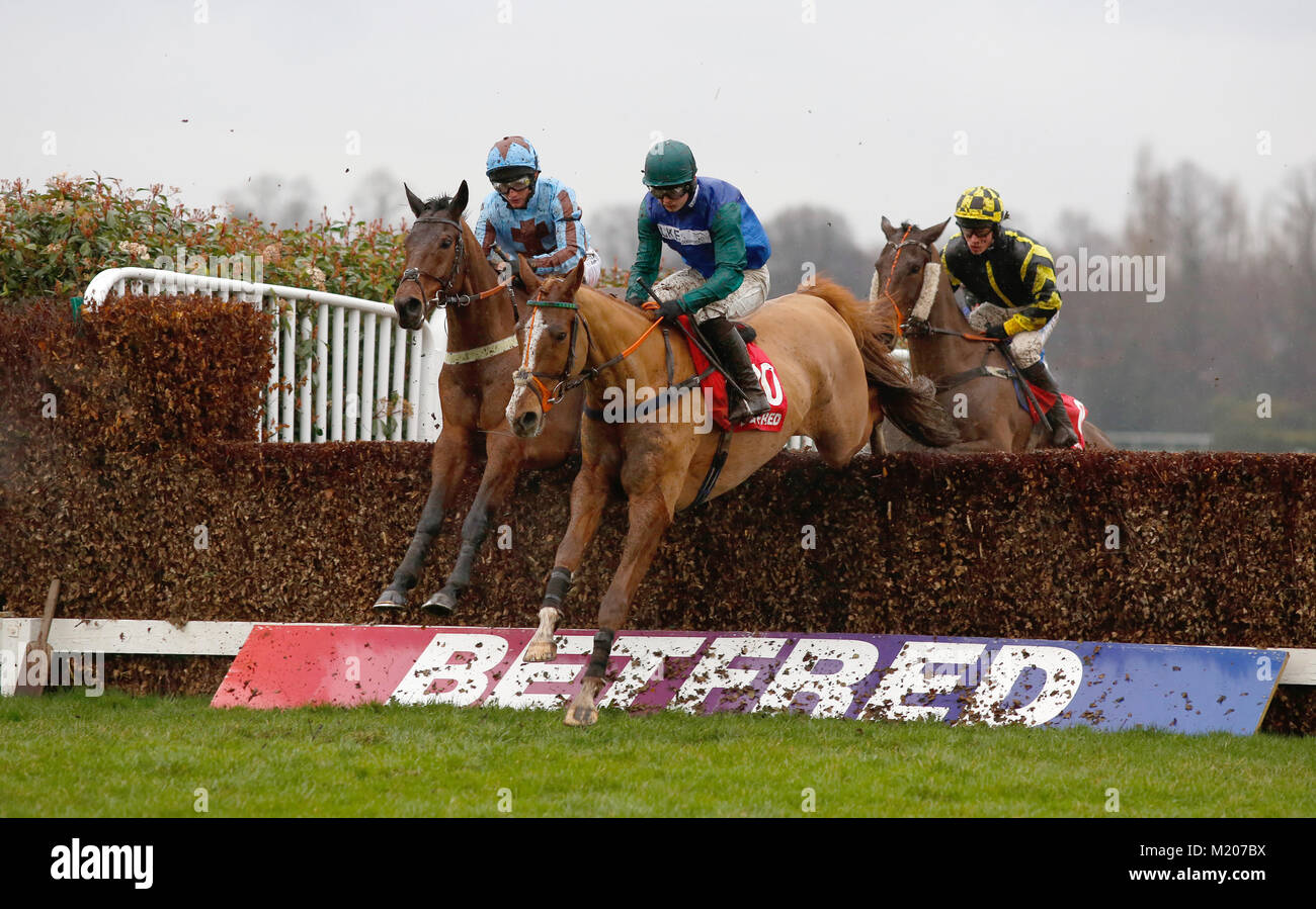 Ballydine and Sean Bowen (right) lead the field over an early fence ...