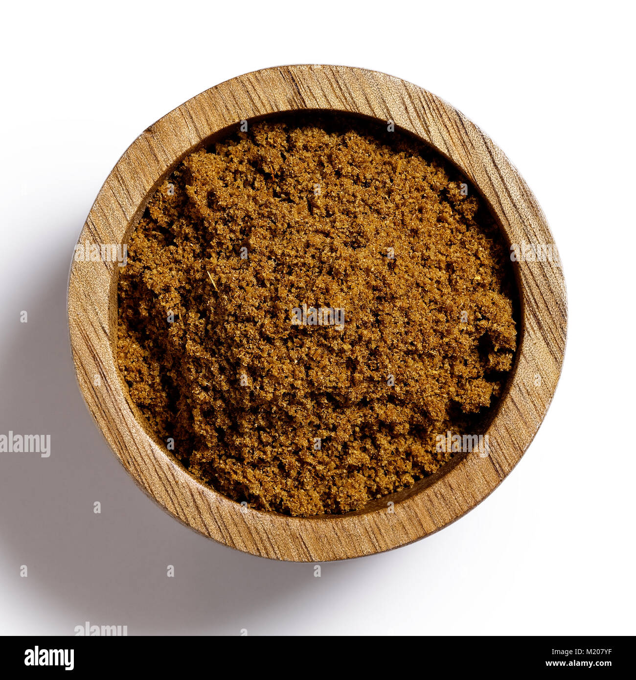Ground cumin in dark wood bowl isolated on white from above Stock Photo ...
