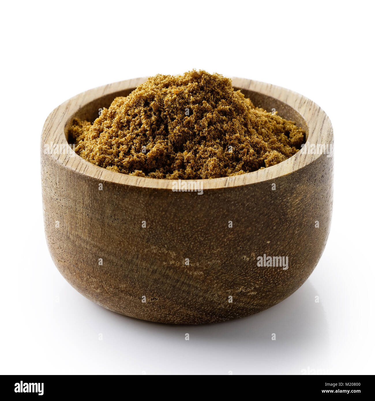 Ground cumin in dark wood bowl isolated on white Stock Photo - Alamy