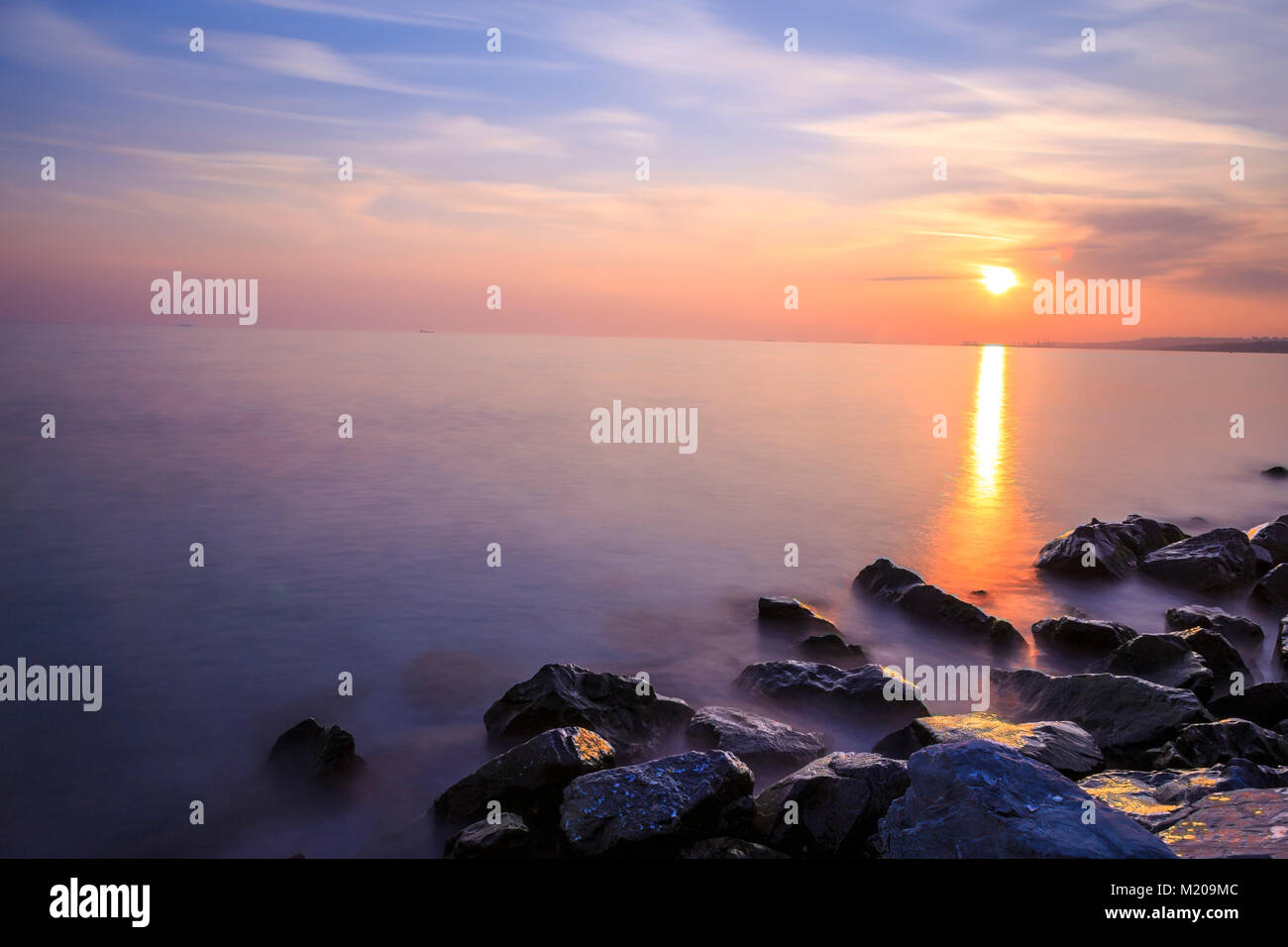 Empty sea and rocks During the sunset with Silky Sea beacuse of the ...