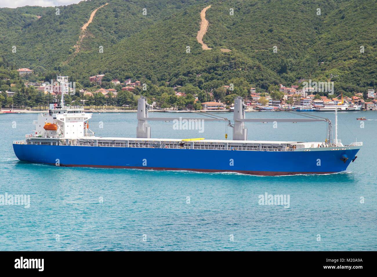Big size freighter ship in sunny day Stock Photo - Alamy