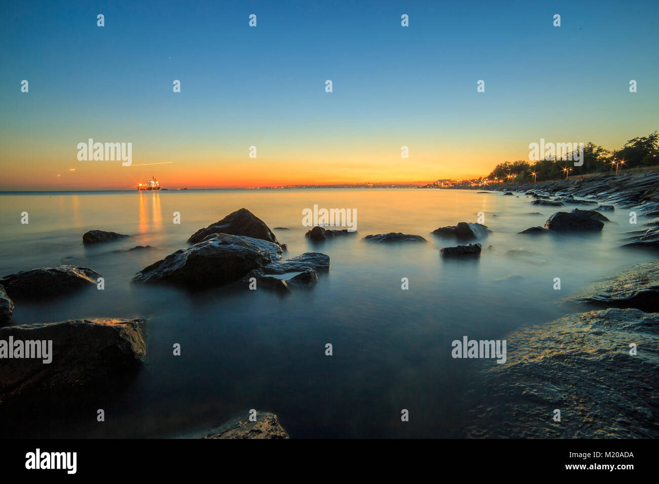 Empty sea and rocks During the sunset with Silky Sea beacuse of the ...