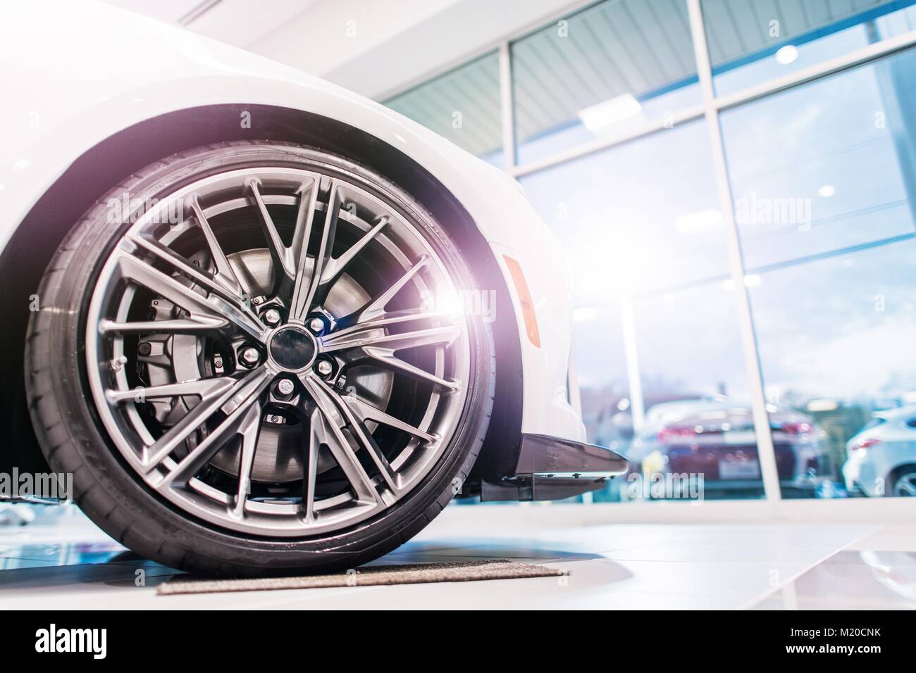 New Car For Sale in Dealership Showroom. Sporty Alloy Wheel Closeup ...