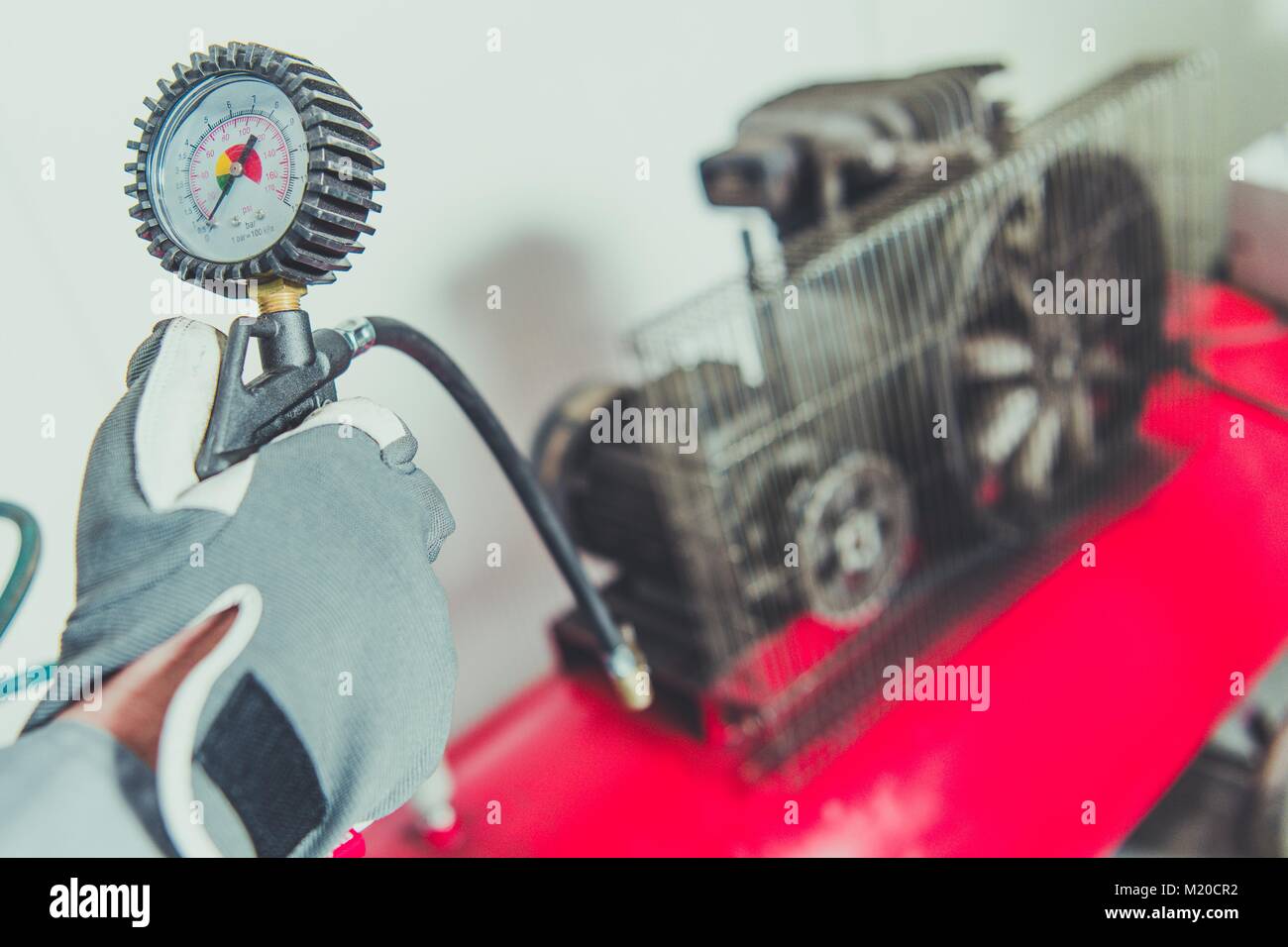 Worker Using Air Compressor Tool. PSI Meter Closeup. Air Pressure ...