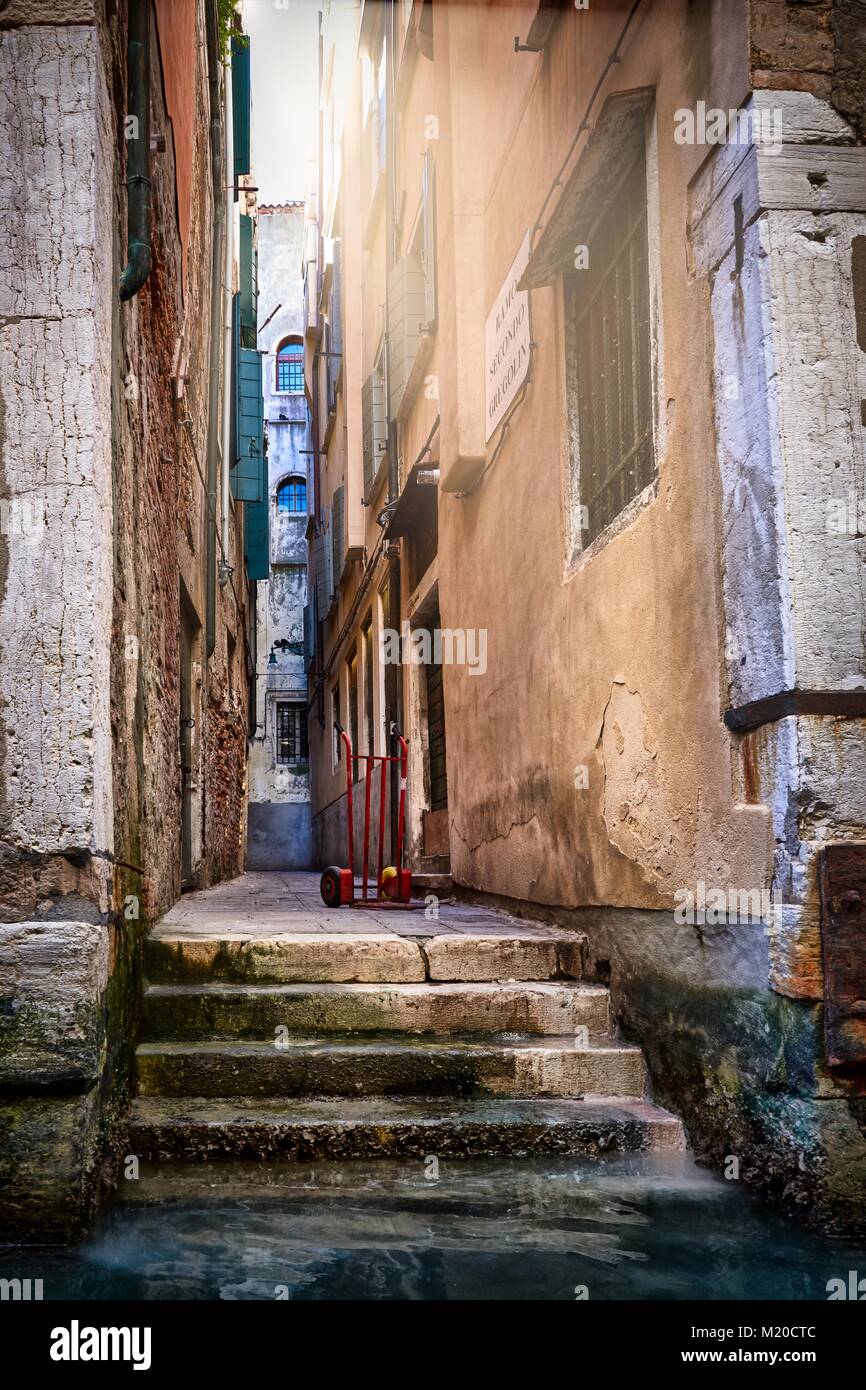 VENICE, ITALY - MAY 21, 2017: Narrow and mysterious alley with stairs ...