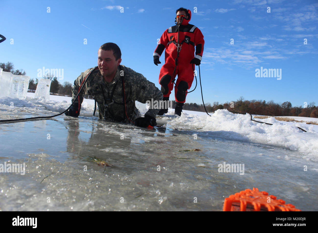 A Soldier participates in cold-water immersion training at an ice ...