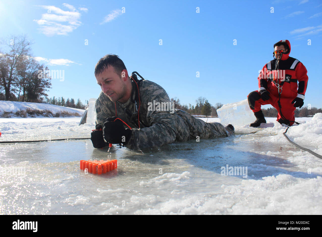 A Soldier participates in cold-water immersion training at an ice ...